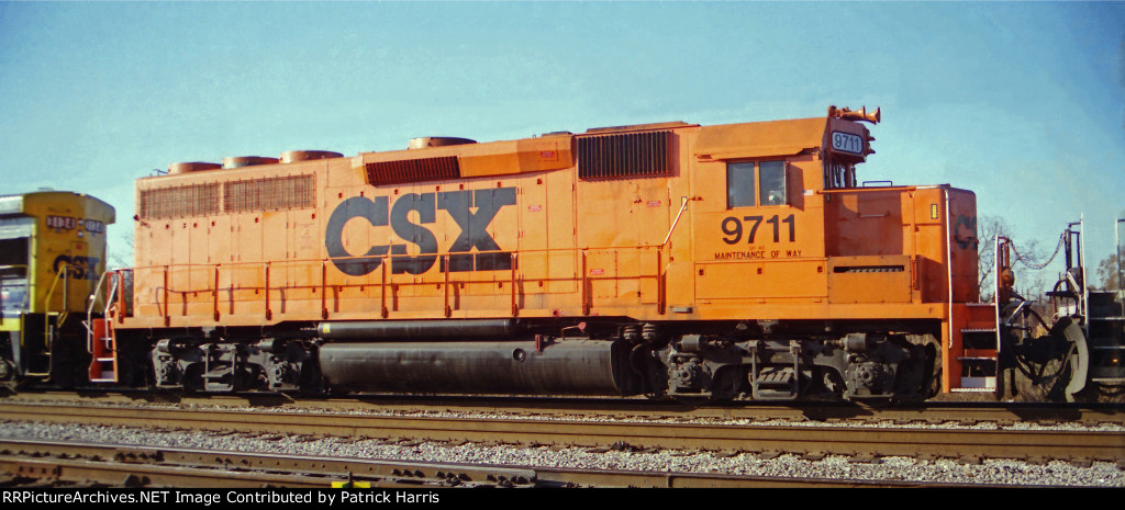 CSX 9711 GP40 X-B&O 4009 in MOW pumpkin orange facing east under late afternoon sunlight in CSX ...